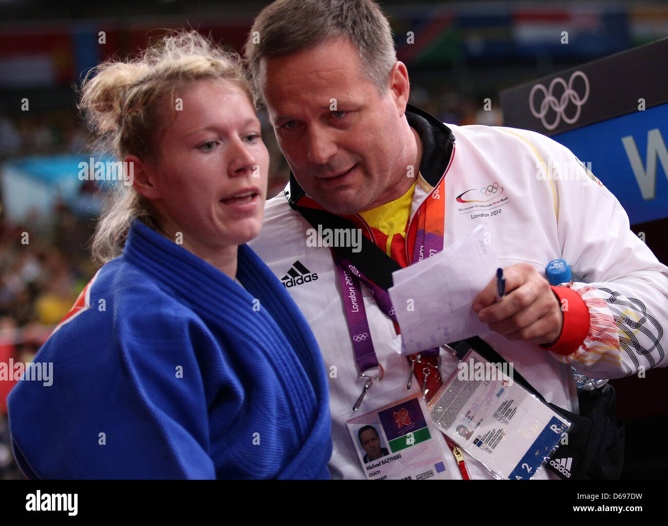 Germany's judoka Kerstin Thiele and her coach Michael Bazynski celebrate after winning her fight ...