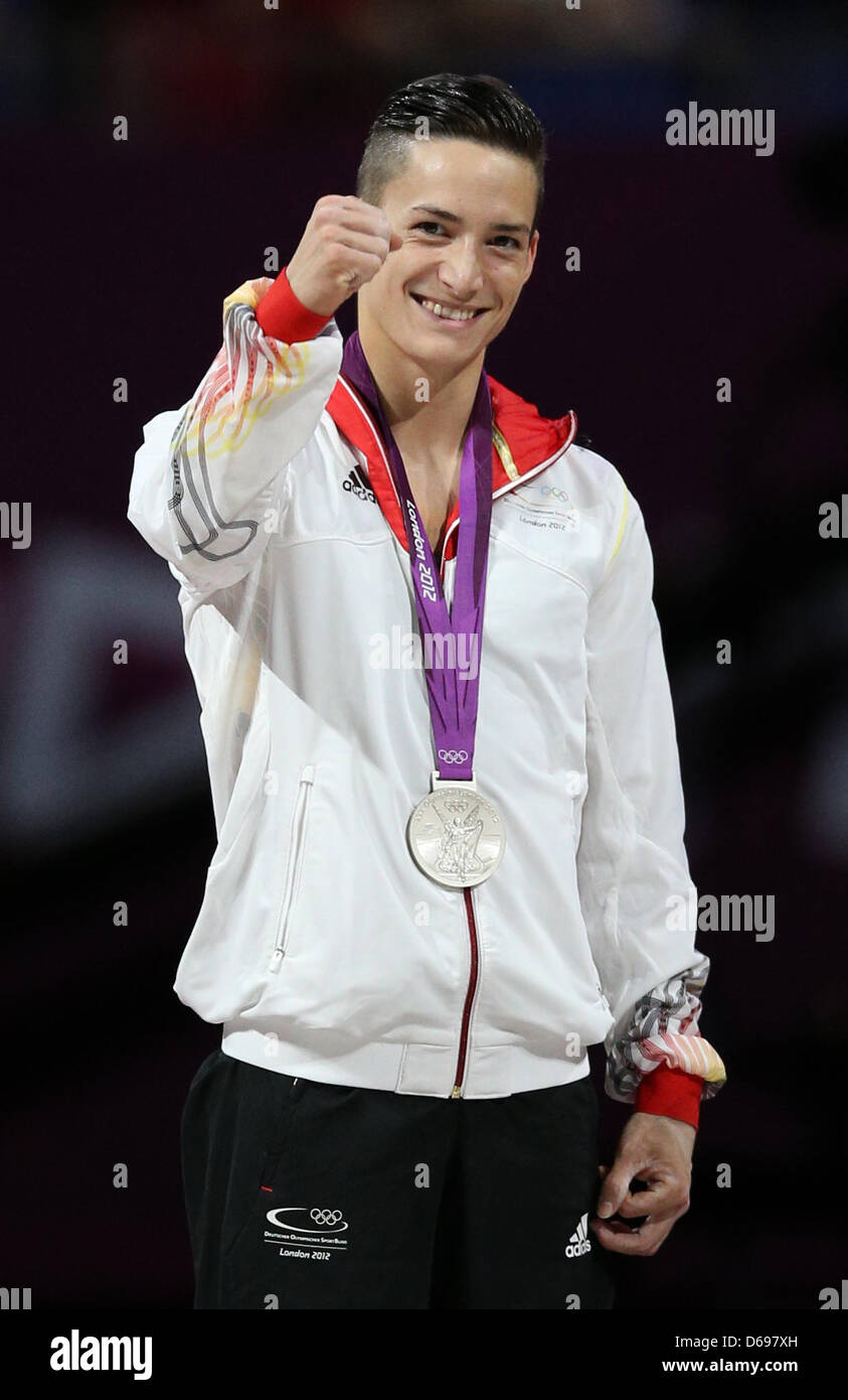 Silver medalist Marcel Nguyen of Germany celebrates on the podium after ...
