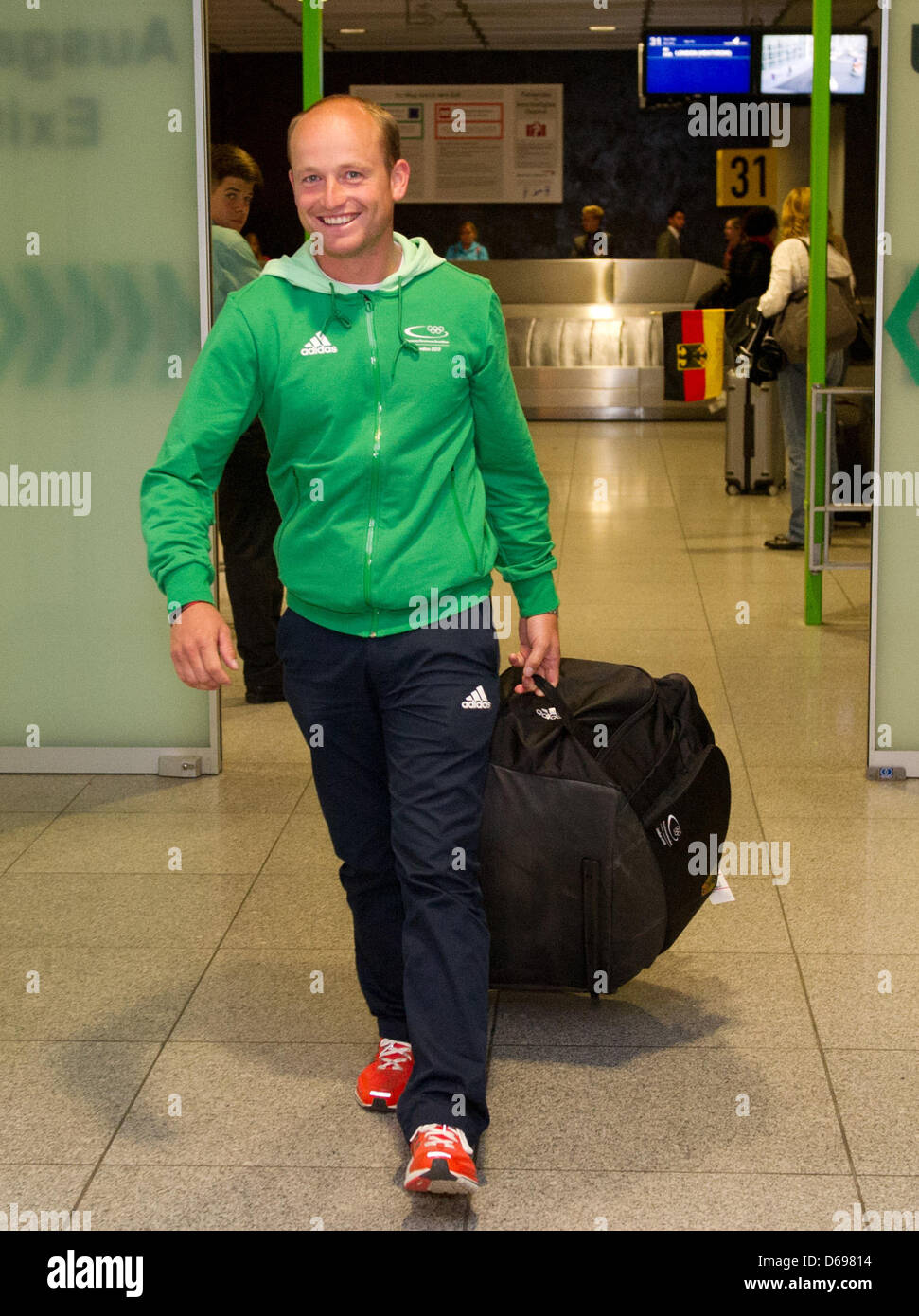 Two-time eventing Olympic champion Michael Jung puts his thumb up as he ...