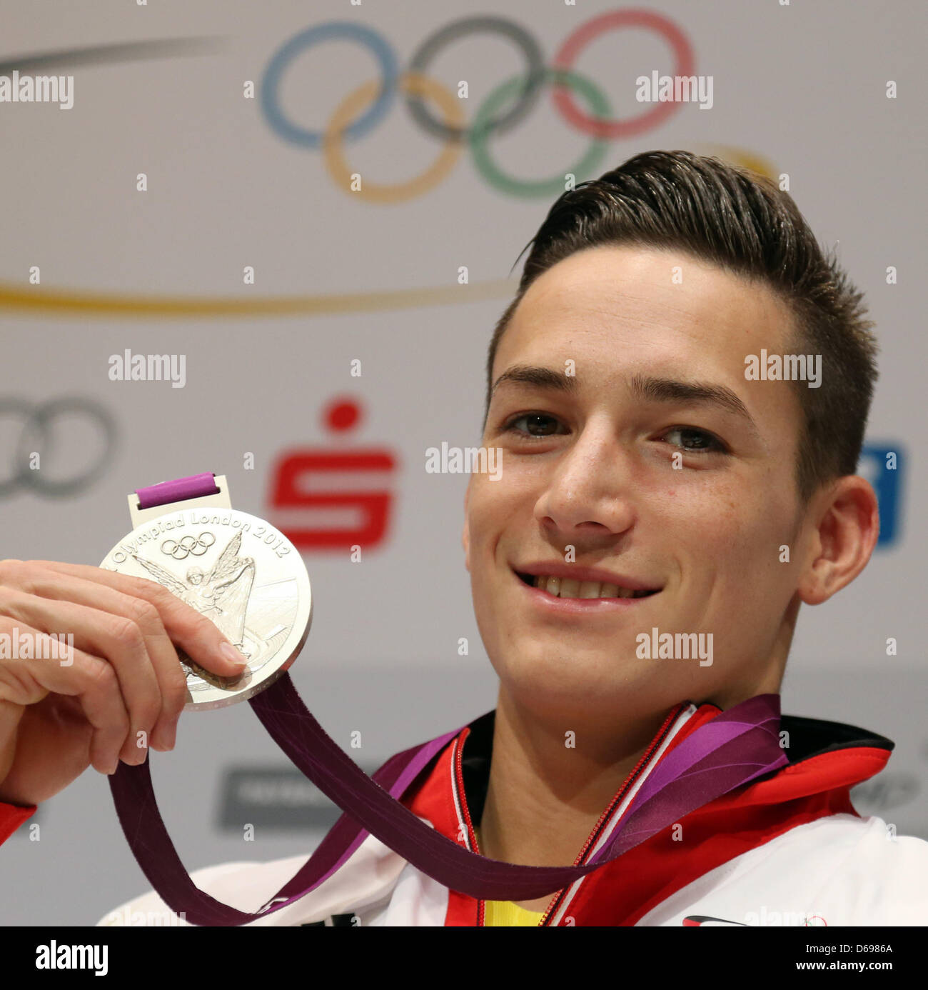 Germany's gymnast and silver medal winner Marcel Nguyen poses with his ...