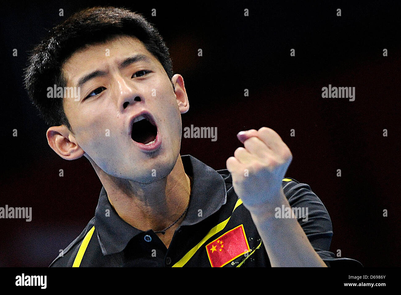 China's Zhang Jike celebrates during his match with Germany's Ovtcharov ...