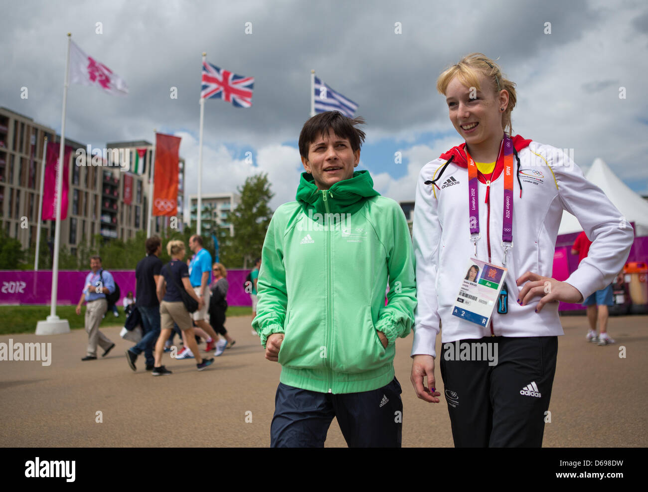 Germany's gymnasts Oksana Chusovitina (l) and Janine Berger walk ...