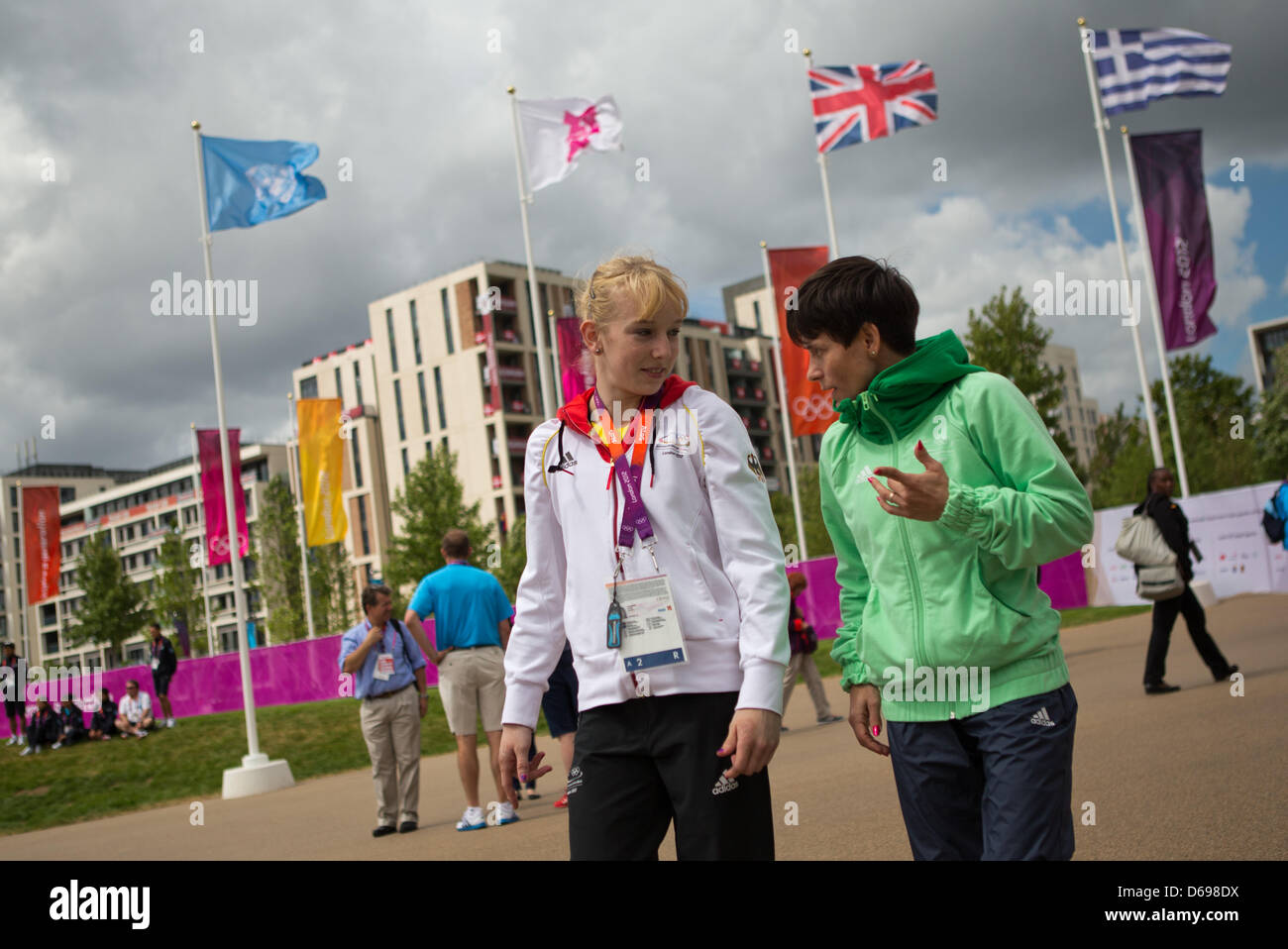 Germany's gymnasts Oksana Chusovitina (r) and Janine Berger walk ...