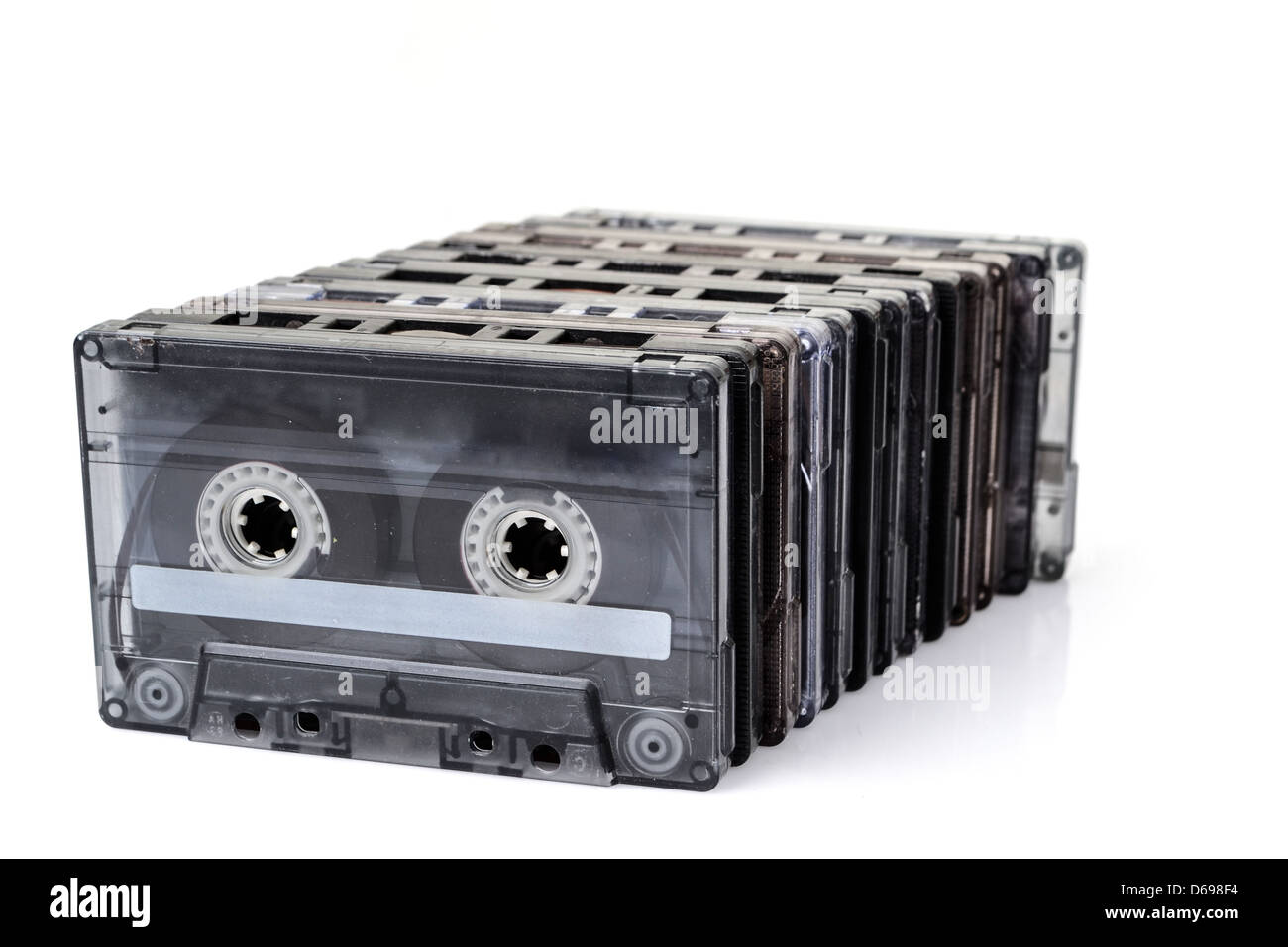 row of audio tapes isolated on white background Stock Photo - Alamy
