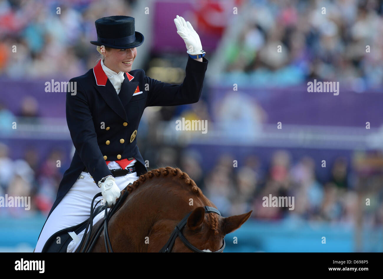 British dressage rider Laura Bechtolsheimer cheers after performing ...