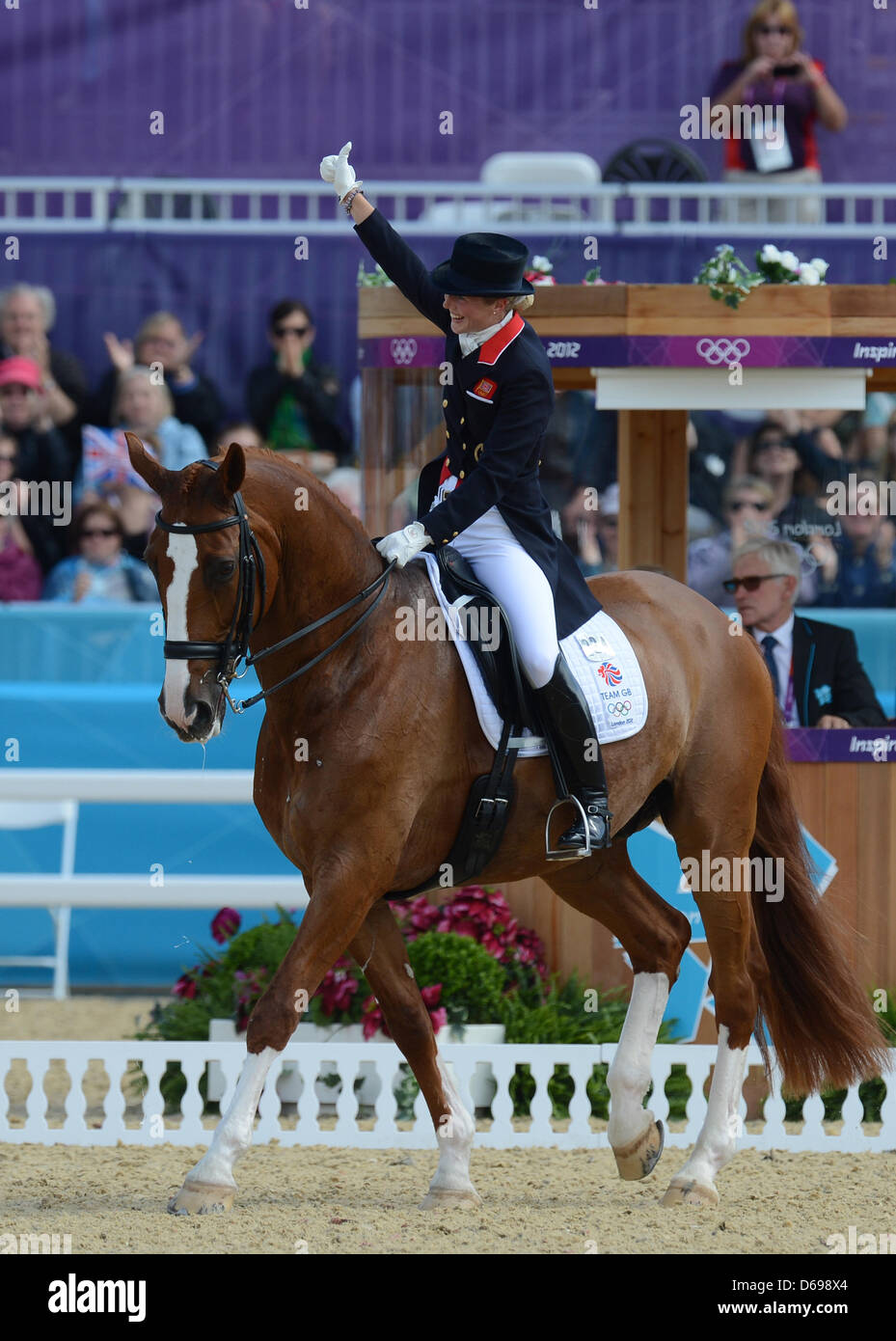 British dressage rider Laura Bechtolsheimer cheers after performing ...