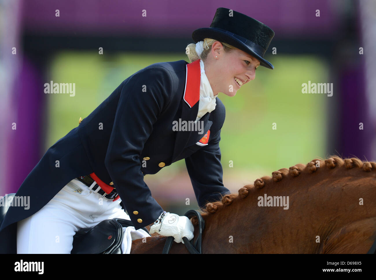 British dressage rider Laura Bechtolsheimer cheers after performing ...