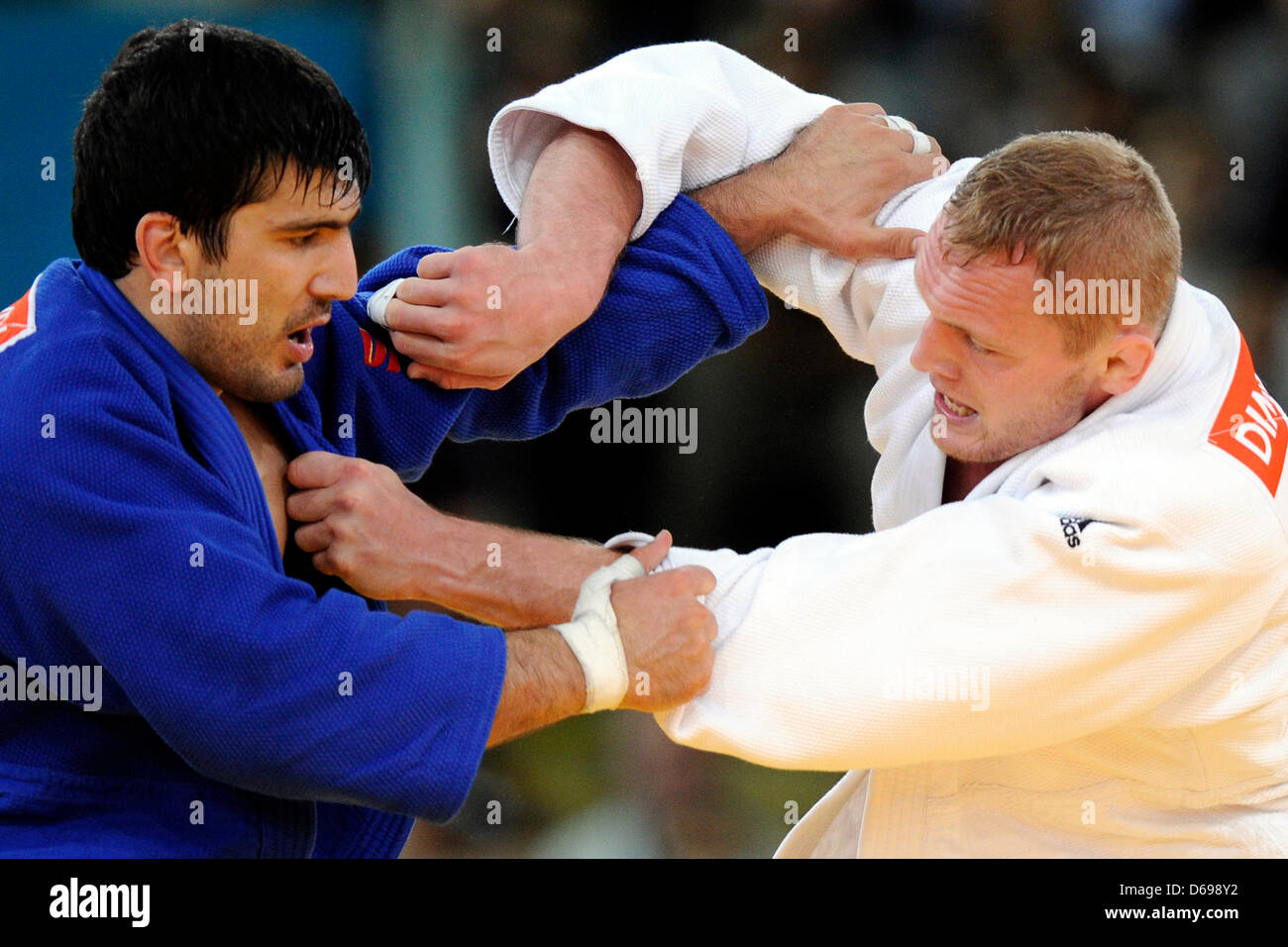 Germany's Dimitri Peters (R) fights with Tagir Khaibulaev of Russia in ...