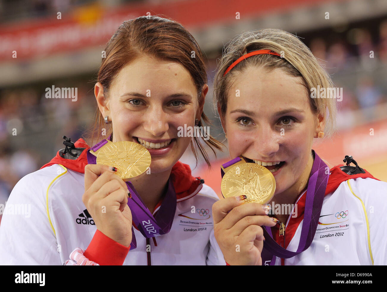 Germany's Miriam Welte (L) and Kristina Vogel pose with their gold ...