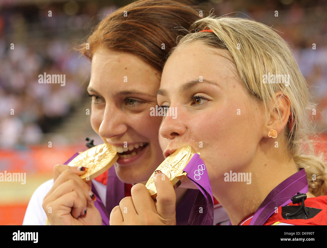 Germany's Miriam Welte (L) and Kristina Vogel pose with their gold ...