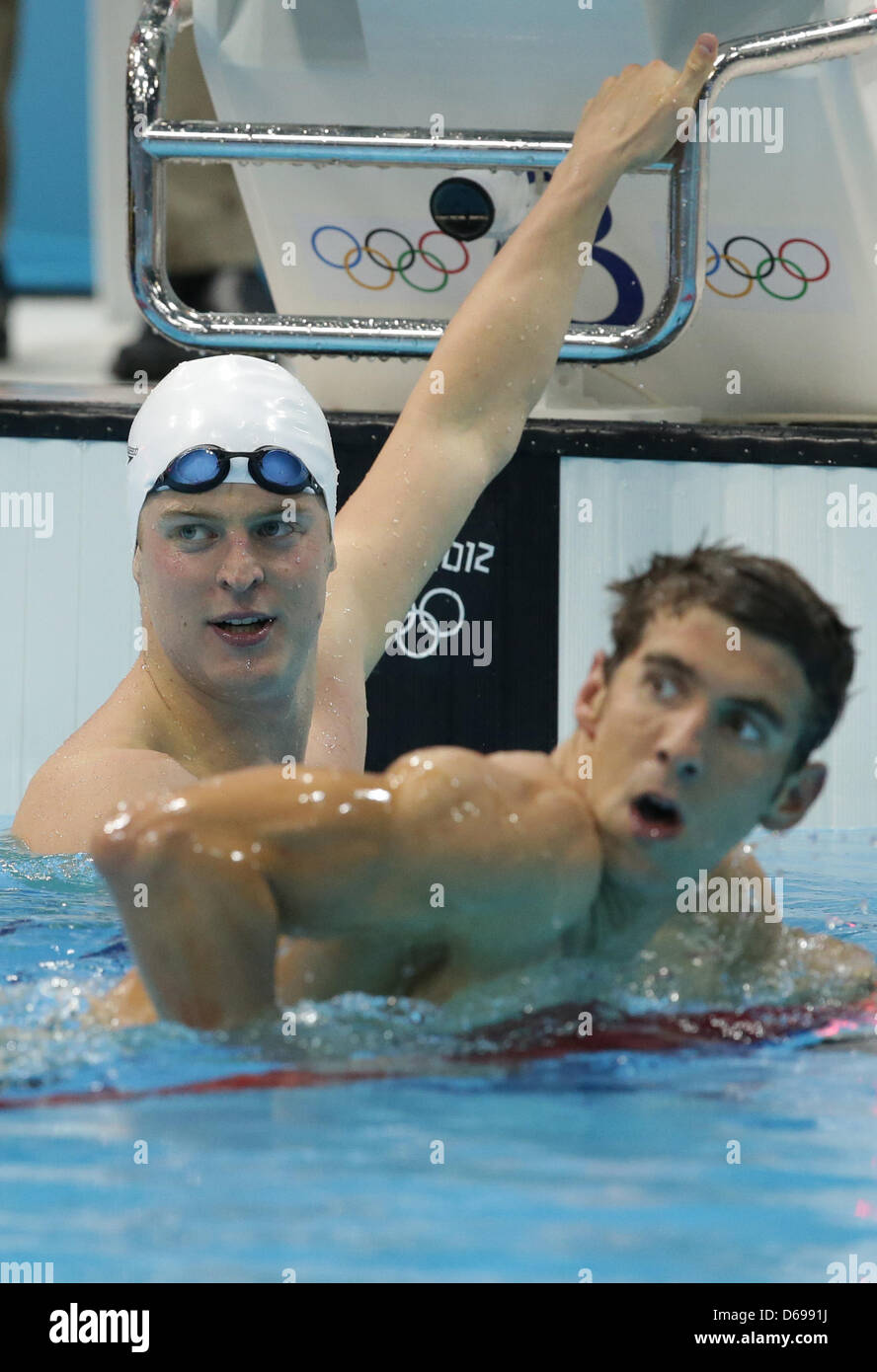 Germany's Steffen Deibler (l) and Michael Phelps after the Men's 100m ...