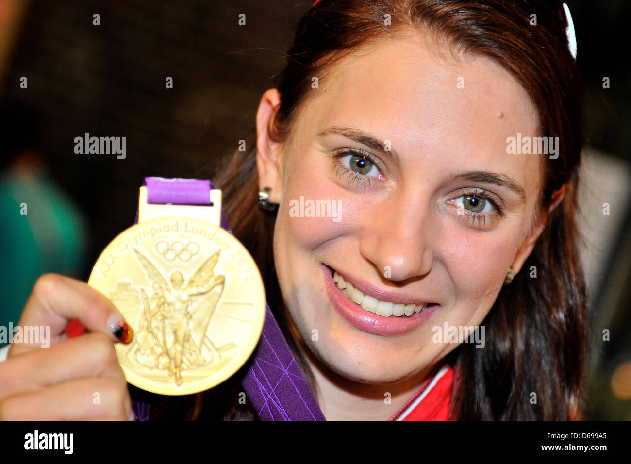 Germany's Miriam Welte poses with her gold medal at the German House ...