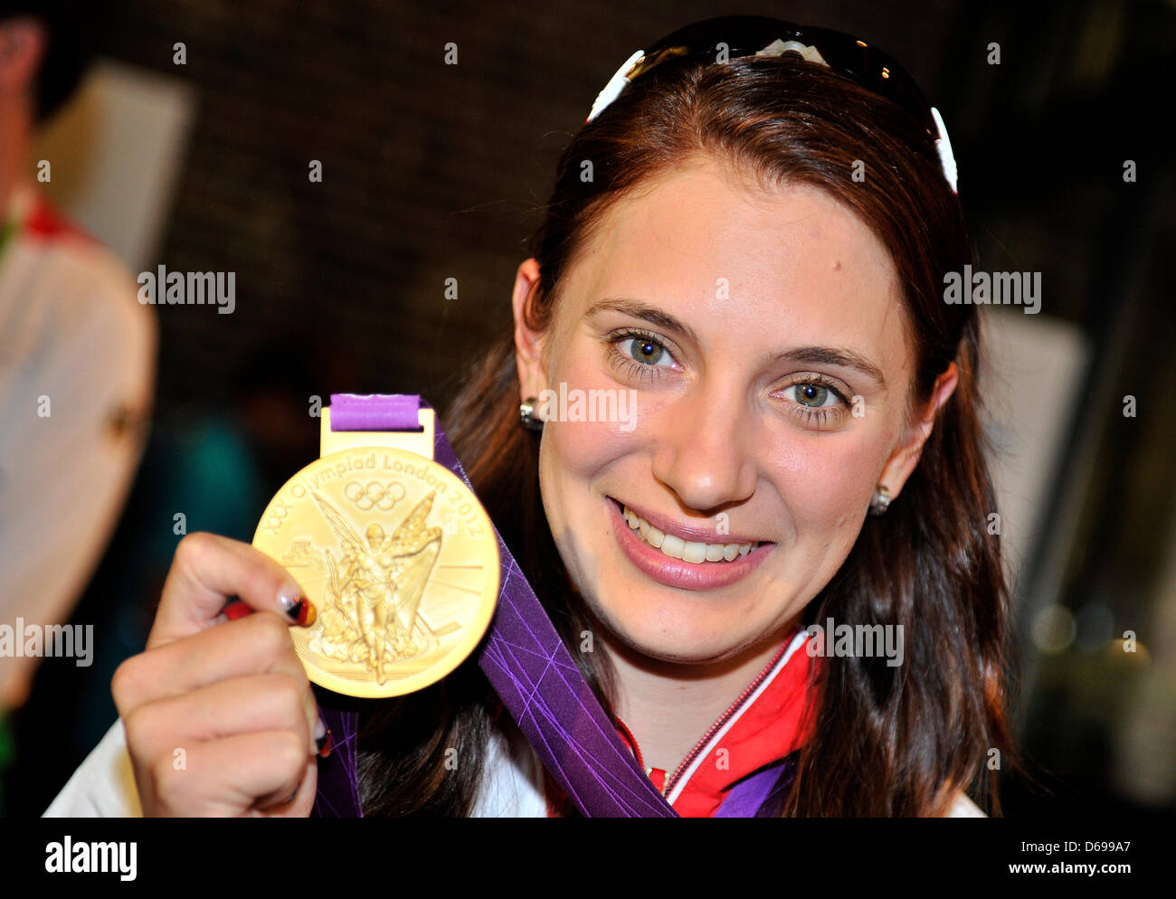Germany's Miriam Welte poses with her gold medal at the German House ...