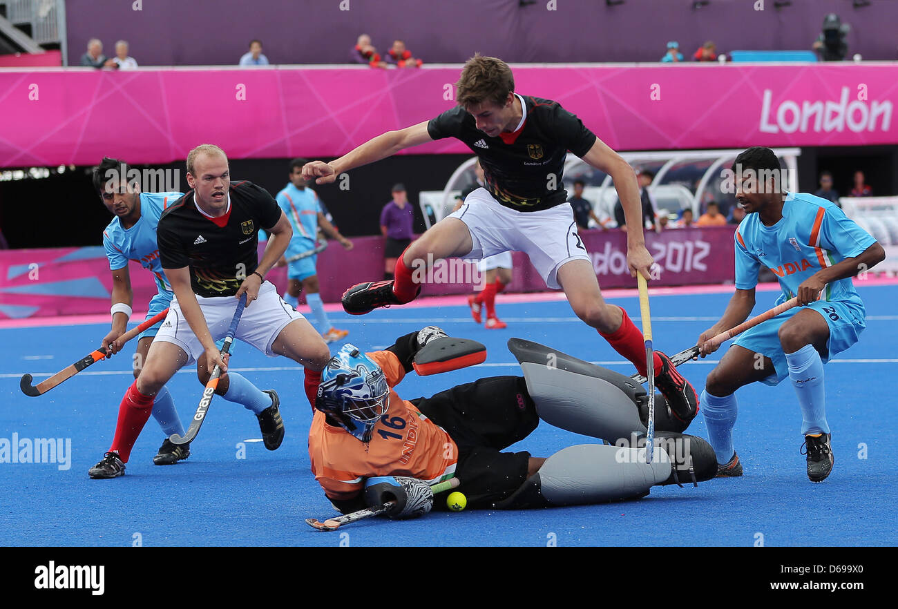 Germany's Florian Fuchs (top) fights for the ball with Goalkeeper ...