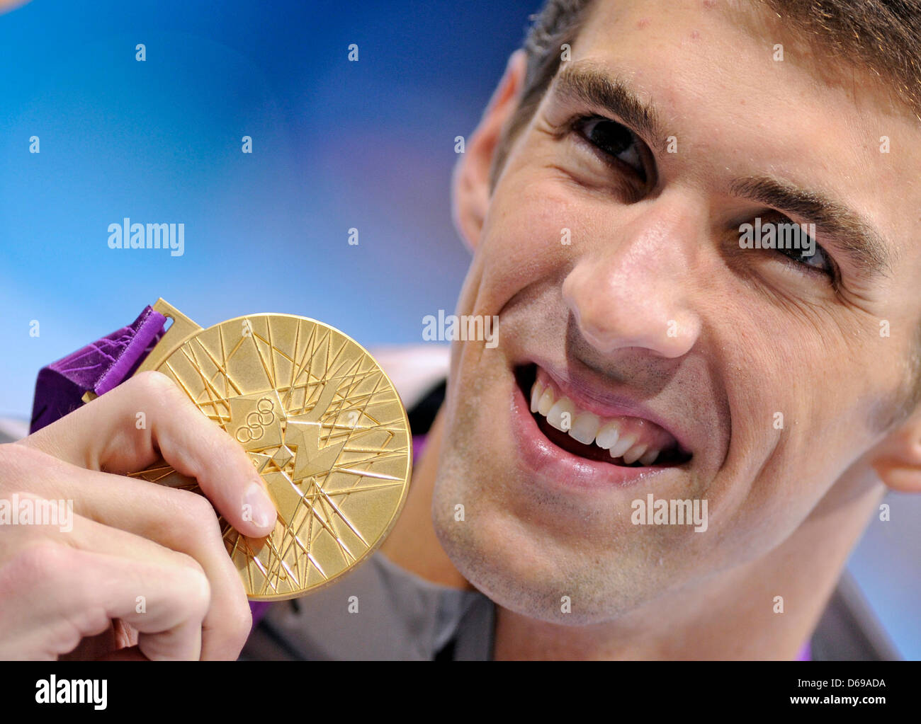 Michael Phelps from USA poses with his gold medal after winning the men ...