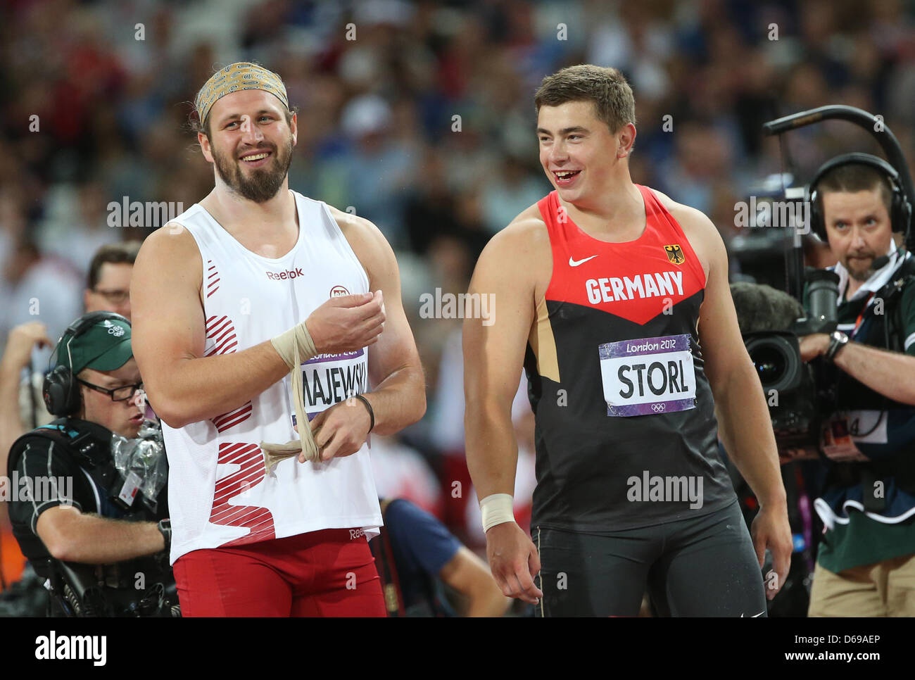Tomasz Majewski (L) of Poland walks past Germany's David Storl during ...