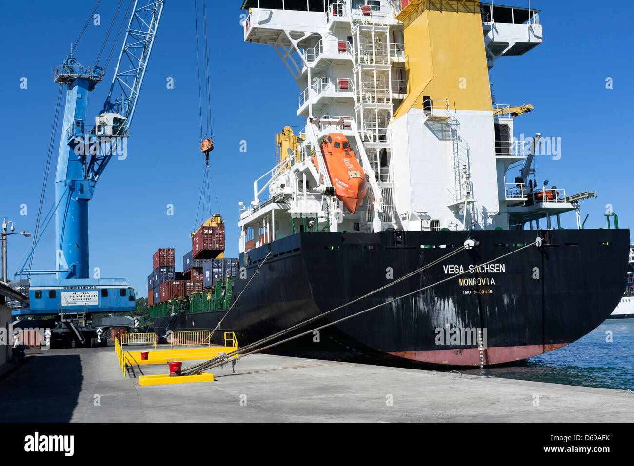 Cargo ship being unloaded while at the docks in Castries, St Lucia ...