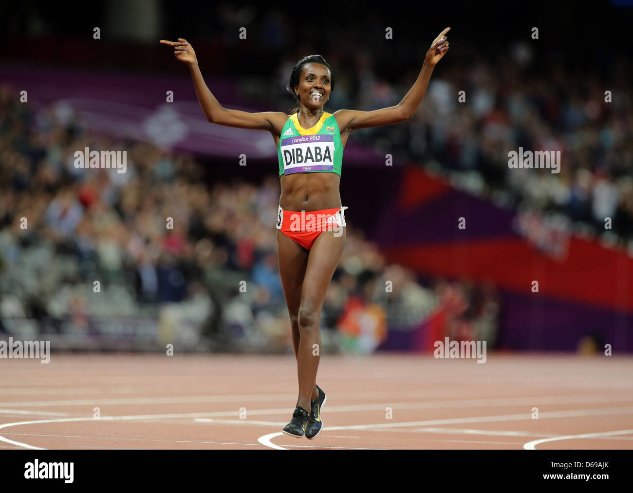 Tirunesh Dibaba of Ethiopia celebrates after winning the women's 10000m ...