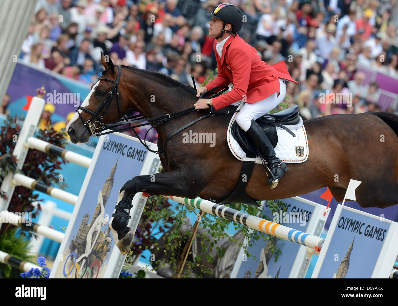 German jumping rider Marcus Ehning jumps with his horse Plot Blue an ...