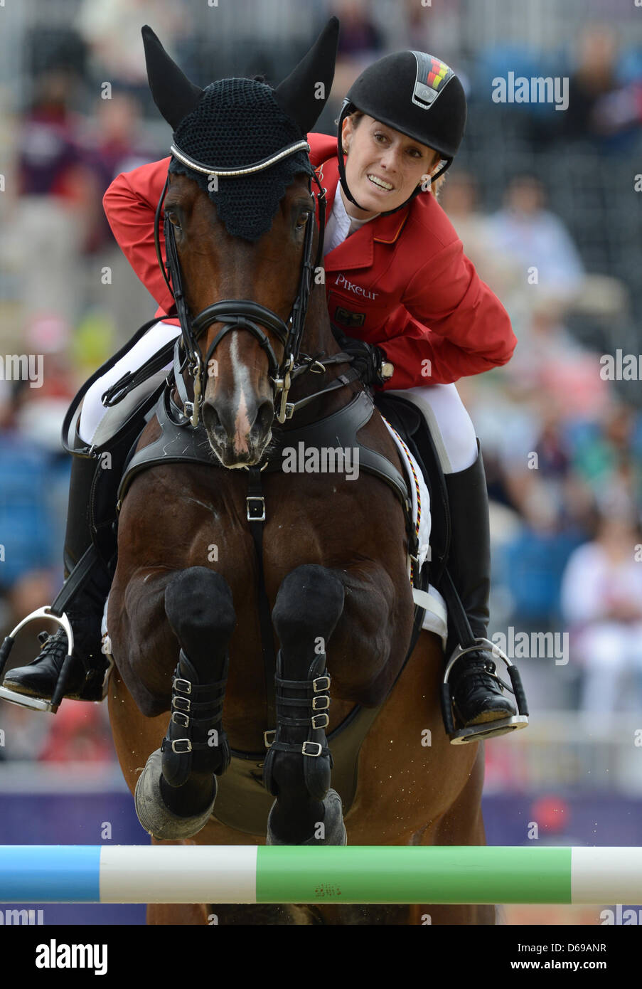 Germany's jumping rider Janne Friederike Meyer jumps with her horse ...