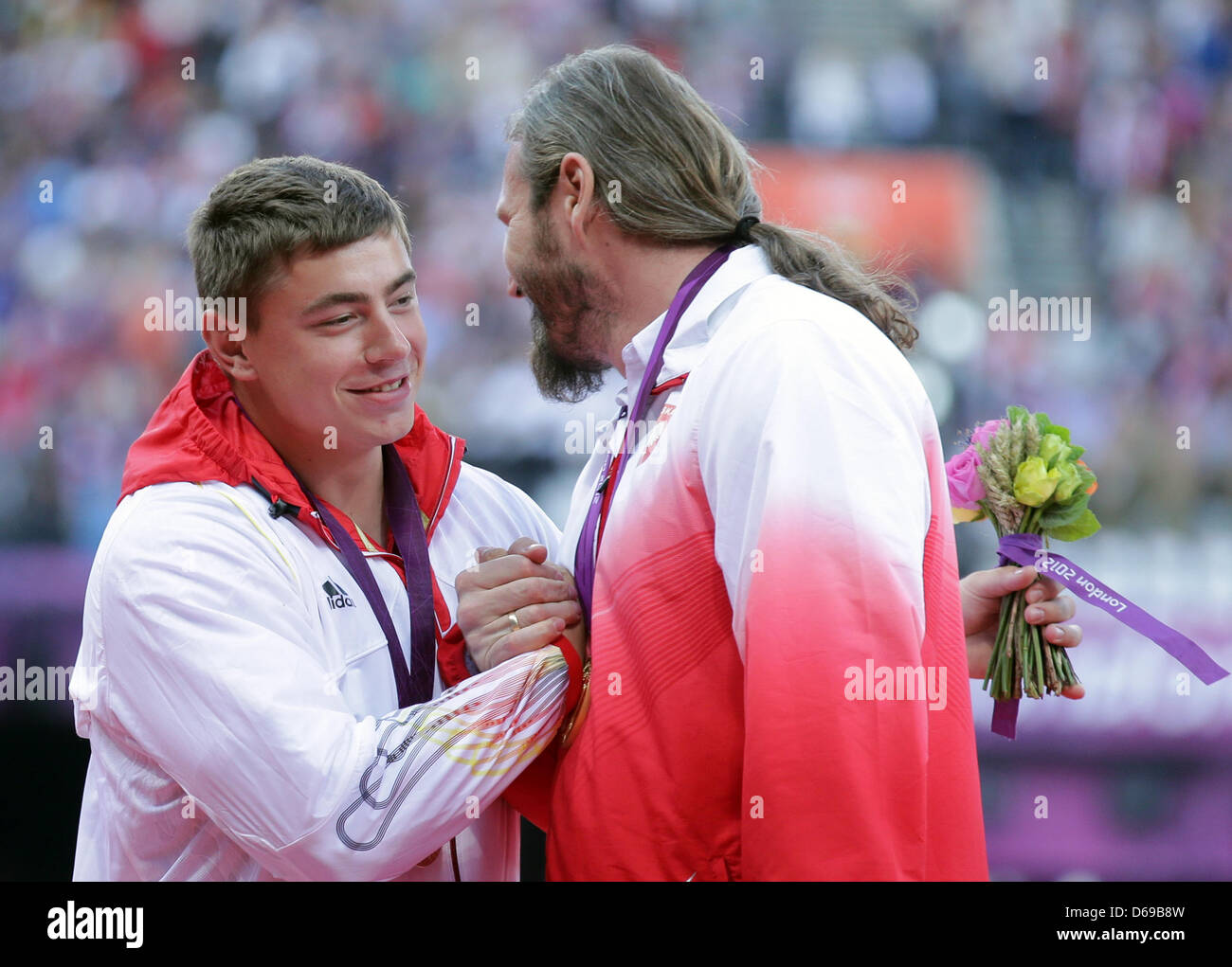 Silver medalist David Storl (L) of Germany congratulates to gold ...