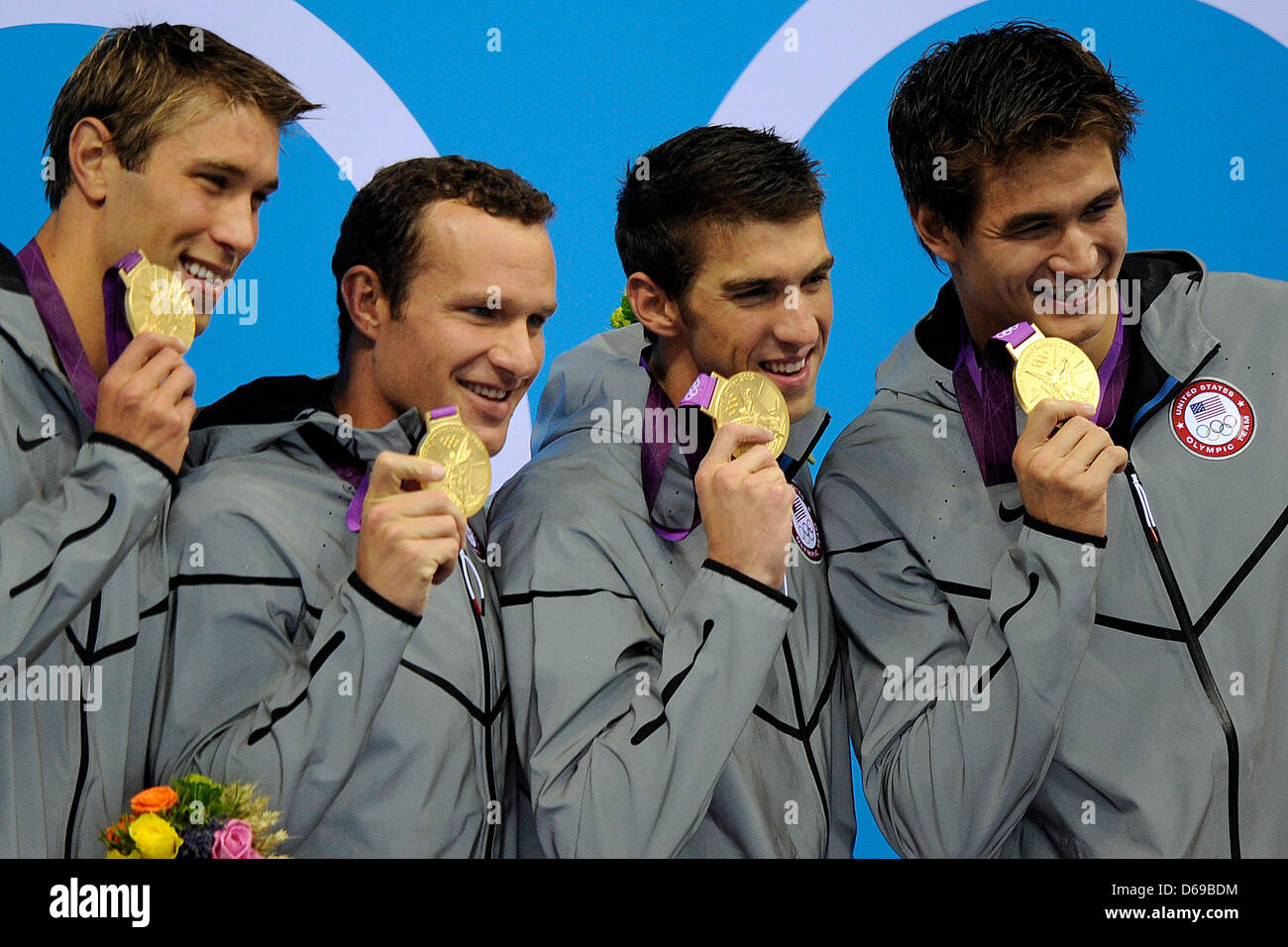 Matthew Grevers (L), Nathan Adrian (R), Michael Phelps (2-R) and ...