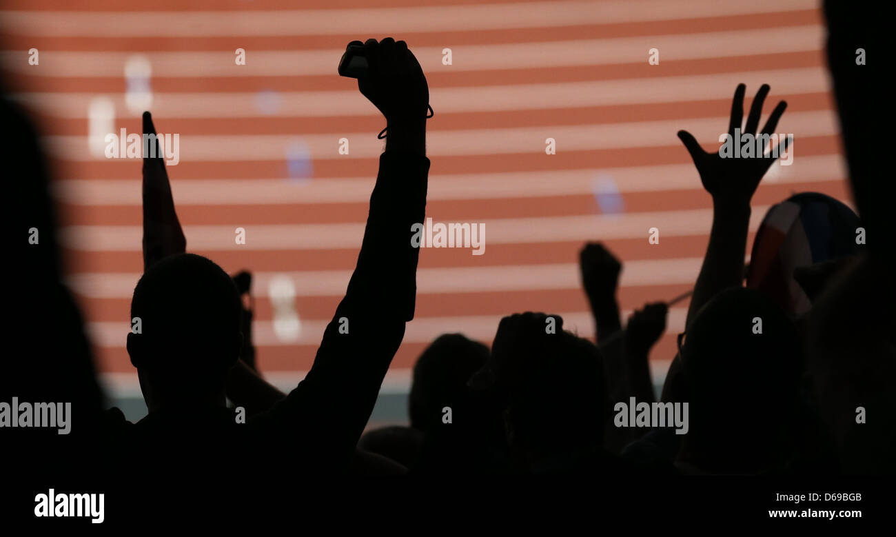 Spectators cheer on the tribune during the Athletics, Track and Field ...