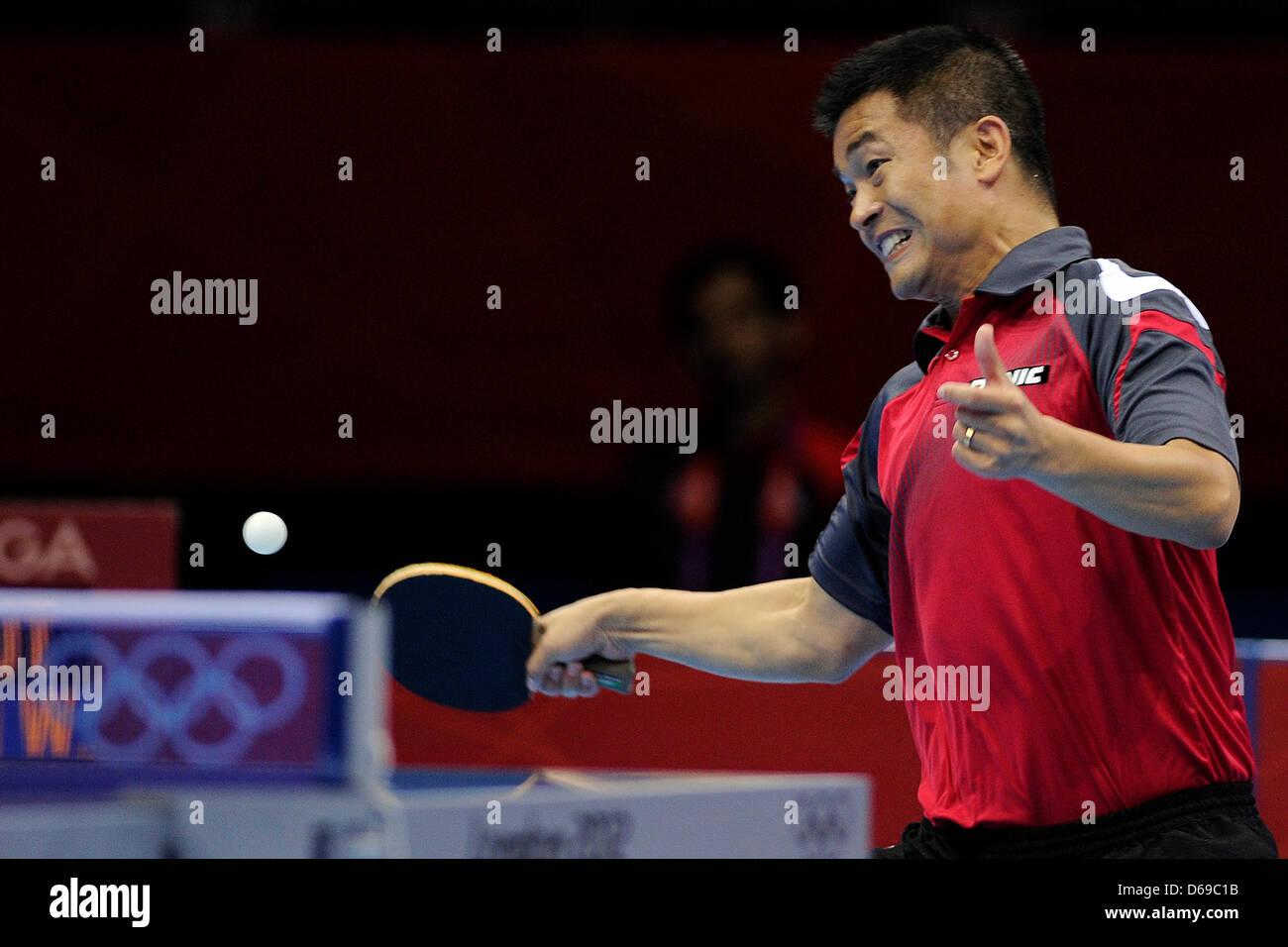 Austria's Chen Weixing (front) in action against Germany's Boll and ...