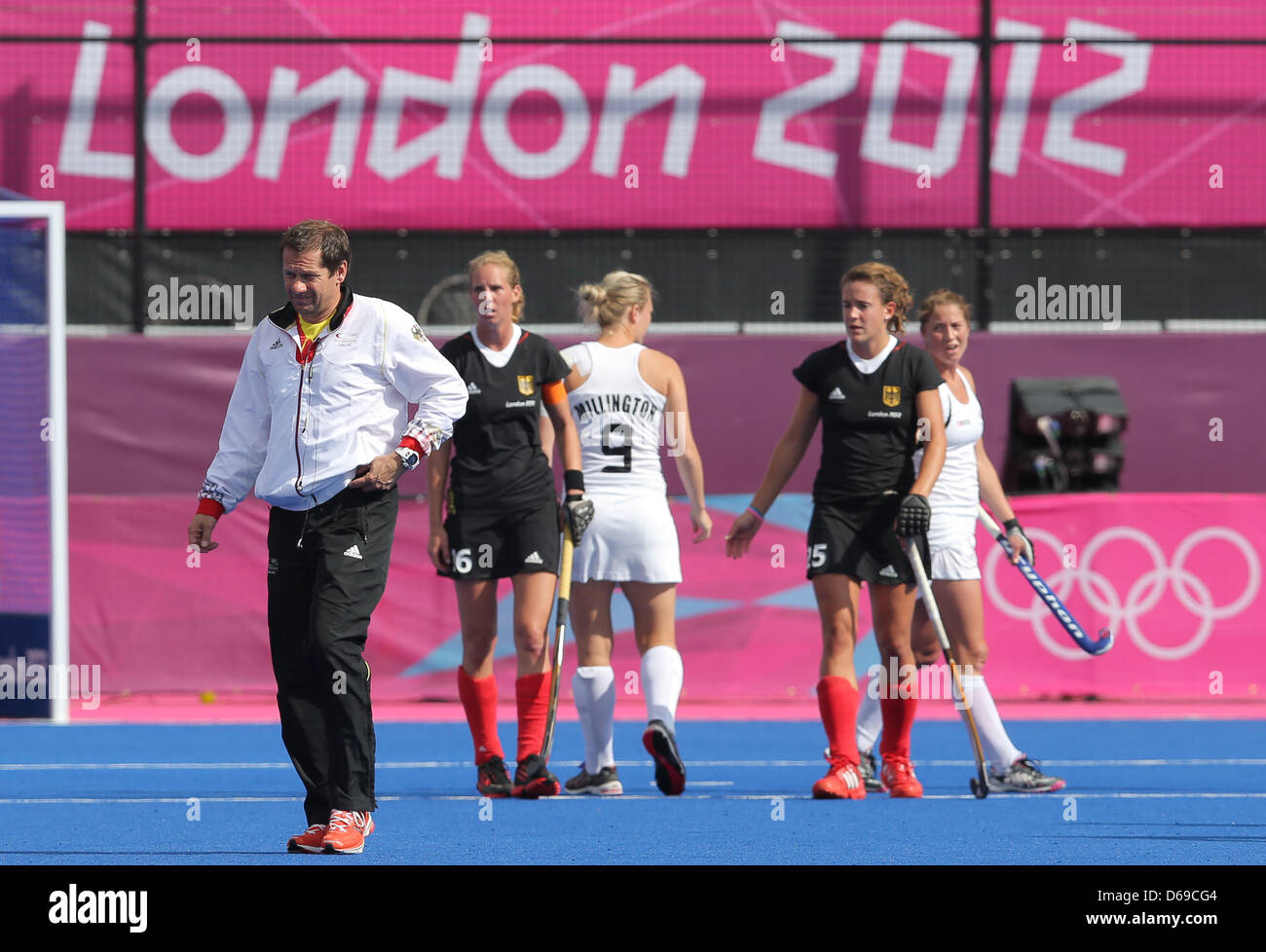 Germany's coach Michael Behrmann (L) looks dejected after the match ...