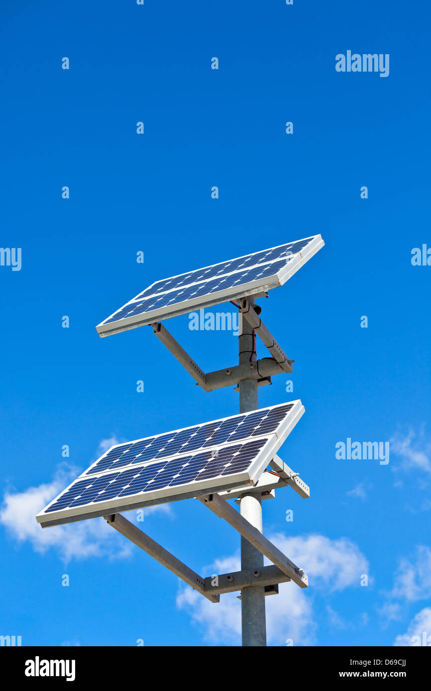 Solar panels on bright blue sky background. Renewable Energy. Vertical ...