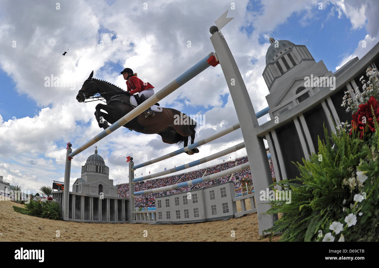 Germany's jumping rider Janne Friederike Meyer jumps with her horse ...