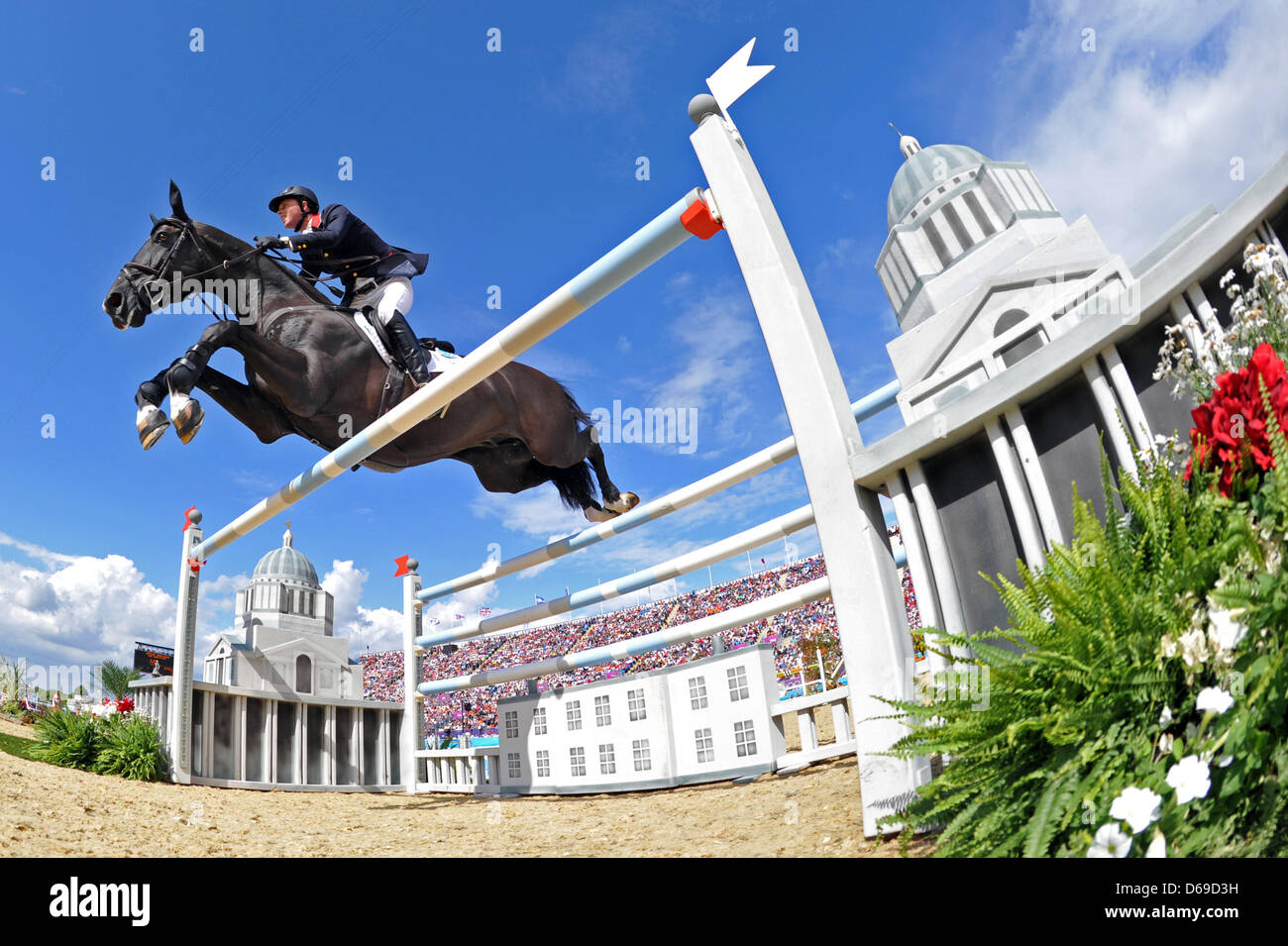 British jumping rider Ben Mayer jumps on his horse Tripple X a fence in ...
