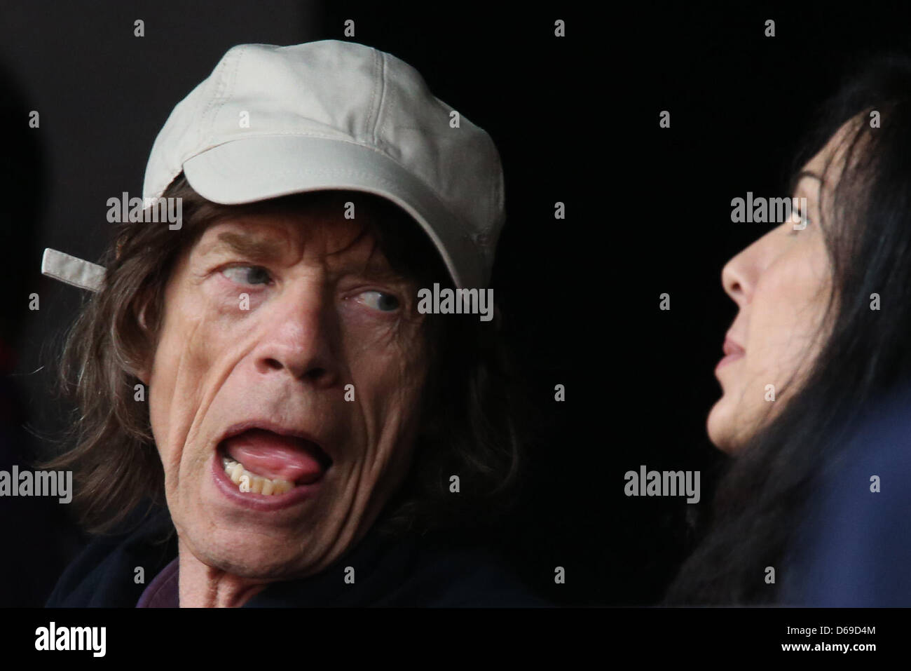 British singer Mick Jagger and his girlfriend L'Wren Scott attend the ...