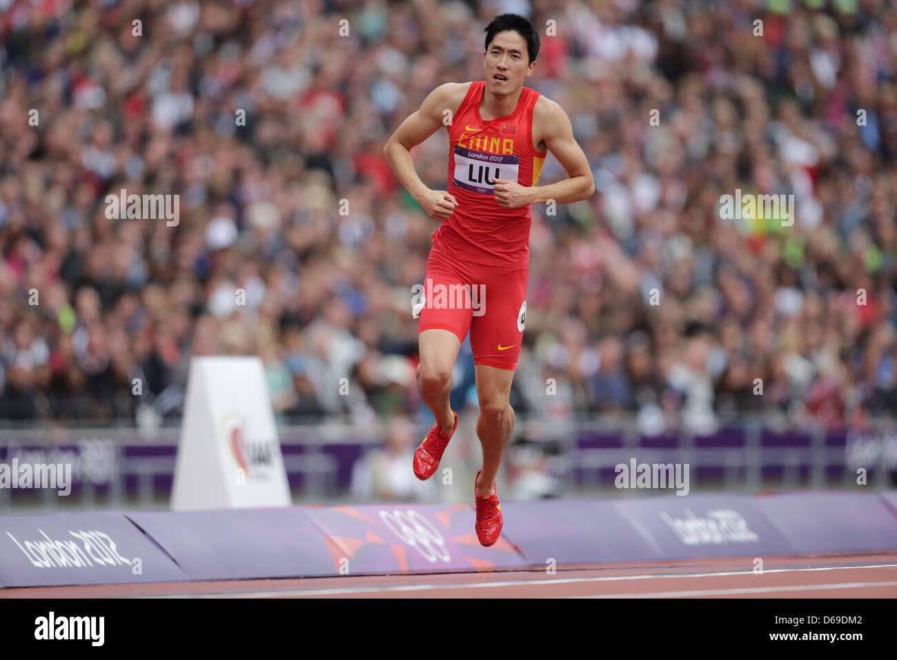 China's Xiang Liu leaves the track, after get injured during the 110m ...