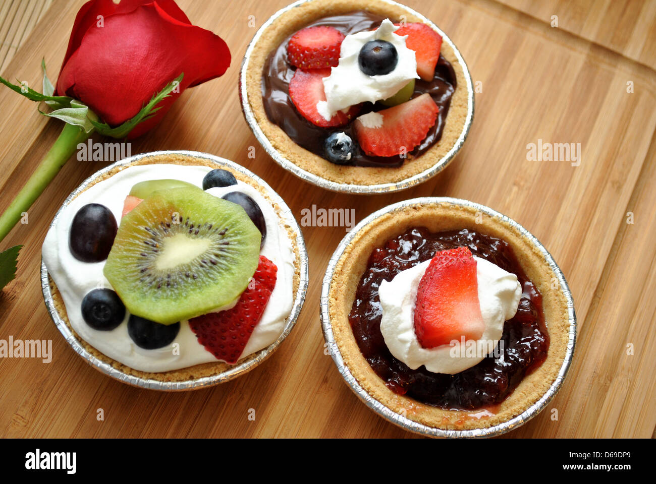 Mini Fruit Desserts with a Rose Stock Photo - Alamy