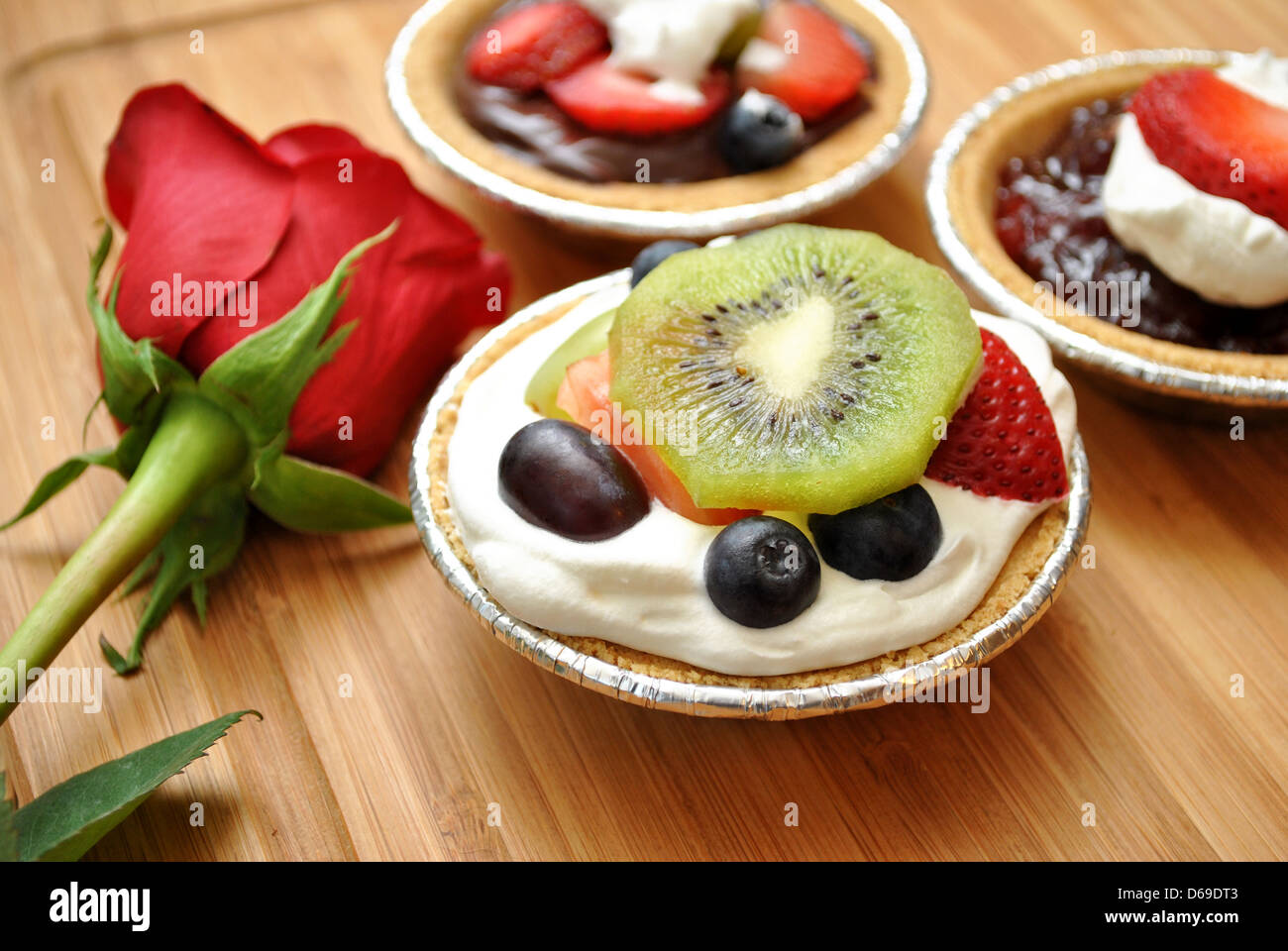 Mini Fruit Pies with a Red Rose Stock Photo - Alamy