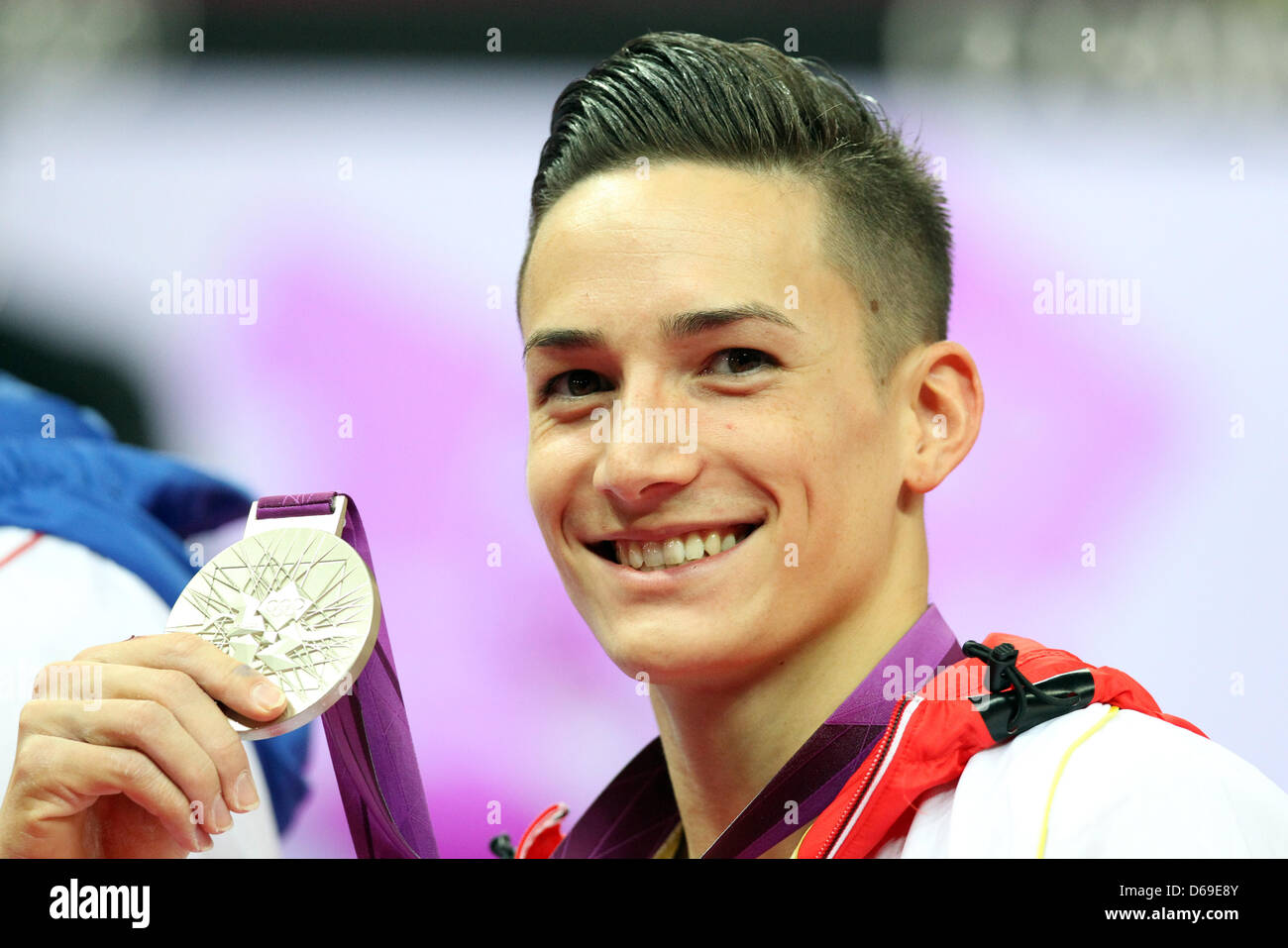 Germany's Marcel Nguyen celebrates after winning the silver medal in ...