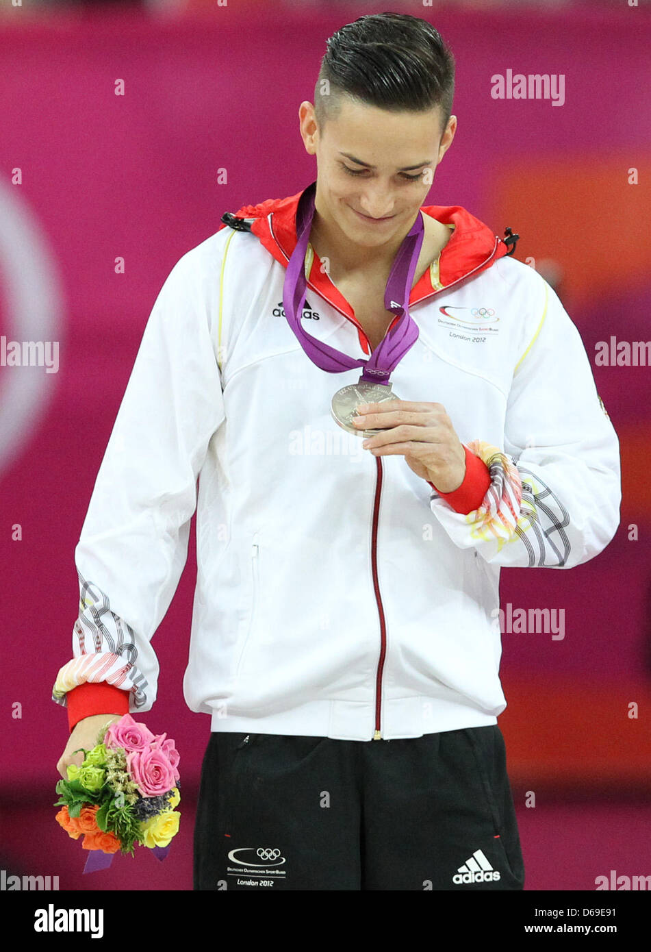 Germany's Marcel Nguyen (C) celebrates after winning the silver medal ...