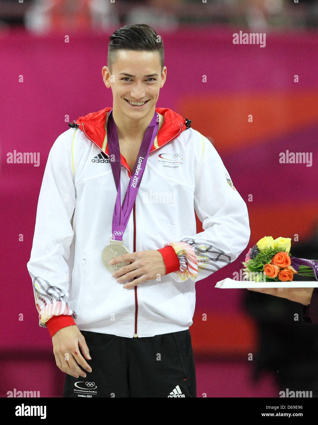 Germany's Marcel Nguyen celebrates after winning the silver medal in ...