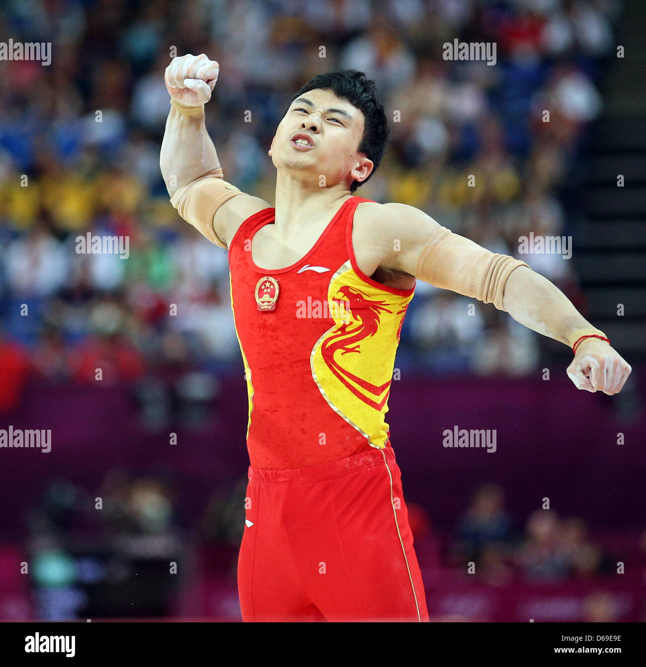 Gold medal winner Zhe Feng of China celebrates after performing during ...