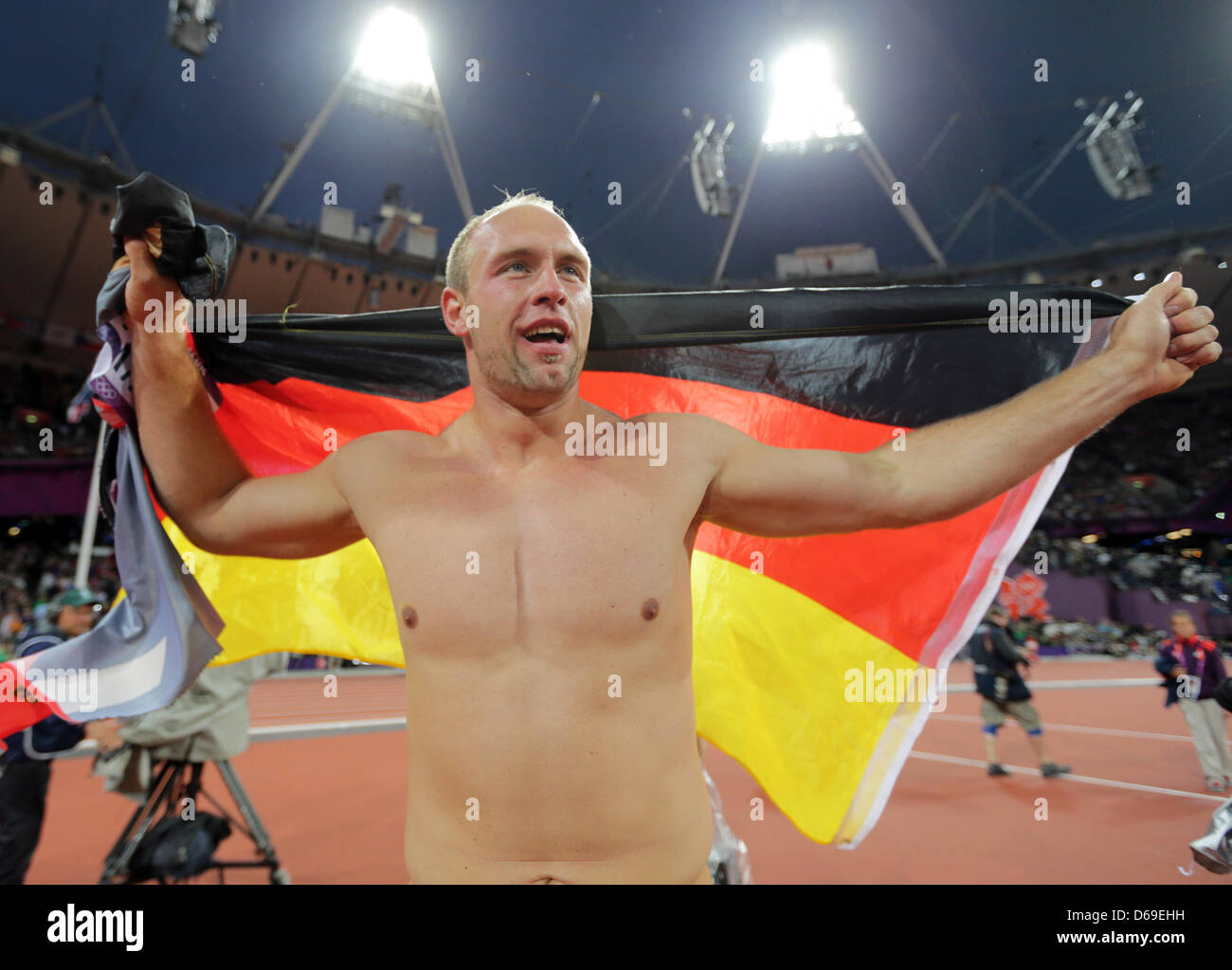 Robert Harting of Germany celebrates after winning the Men's Discus ...