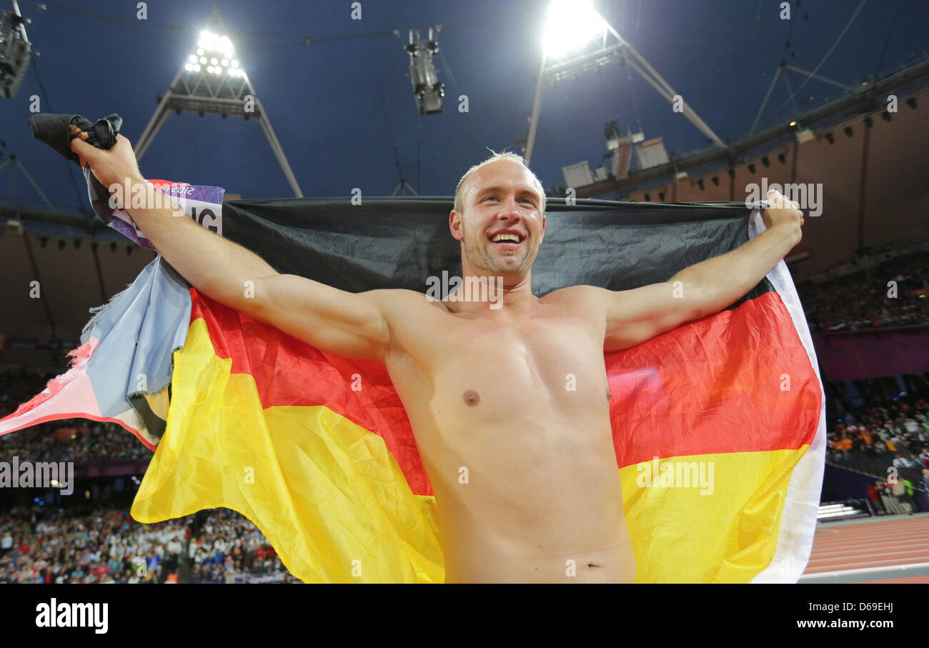 Robert Harting of Germany celebrates after winning the Men's Discus ...