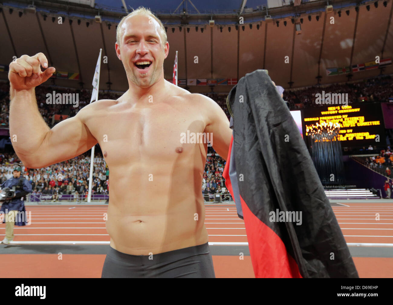 Robert Harting of Germany celebrates after winning the Men's Discus ...