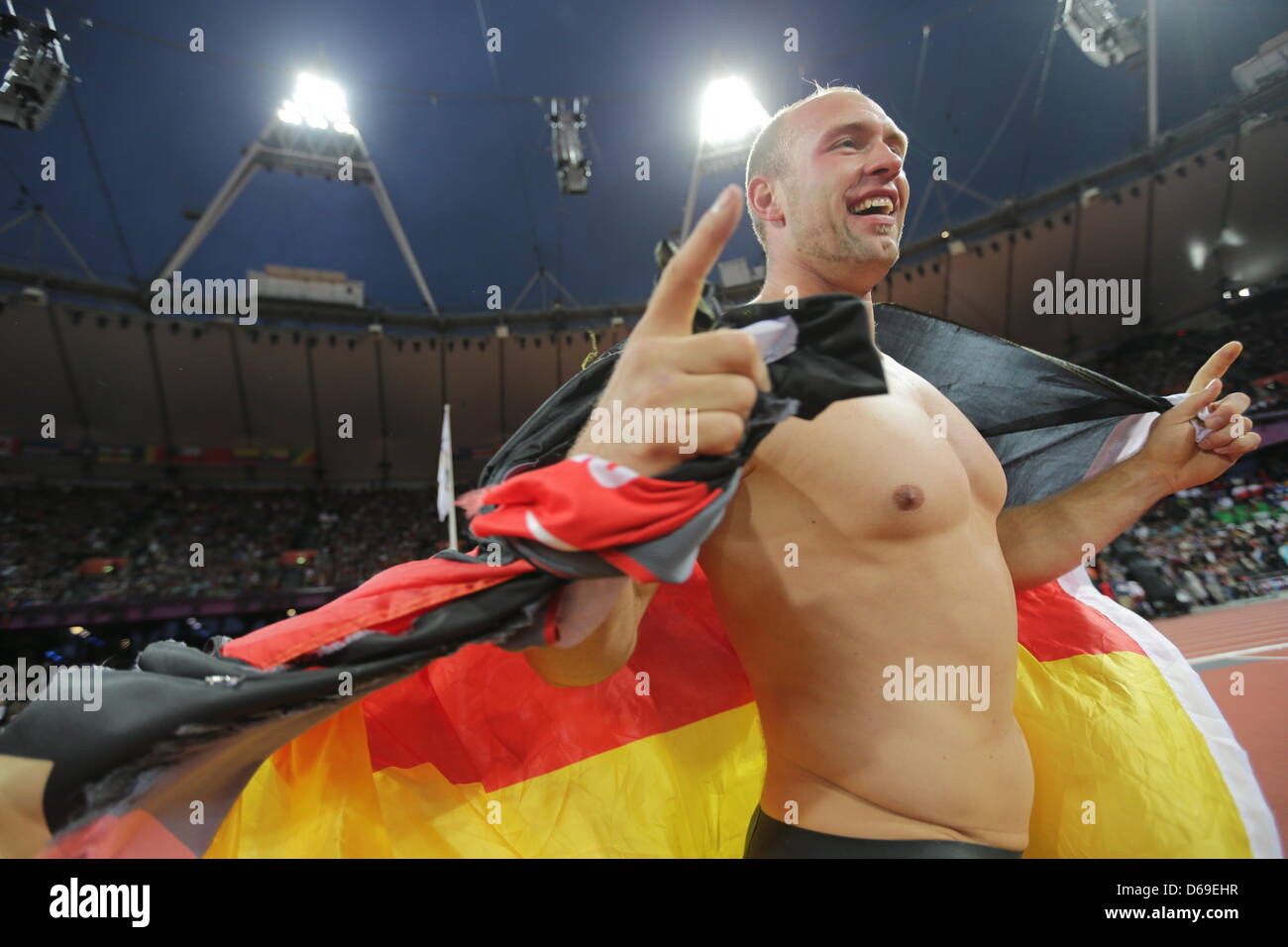 Robert Harting of Germany celebrates after winning the Men's Discus ...