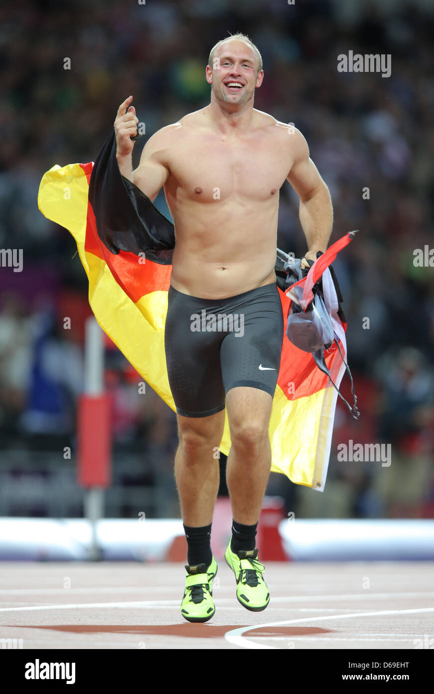 Robert Harting of Germany celebrates after winning the Men's Discus ...