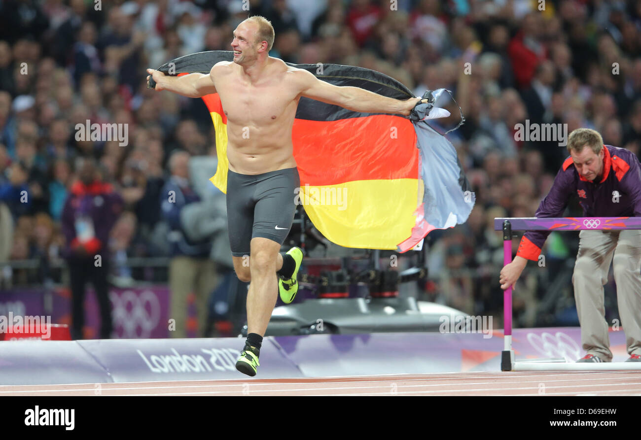 Robert Harting of Germany celebrates after winning the Men's Discus ...