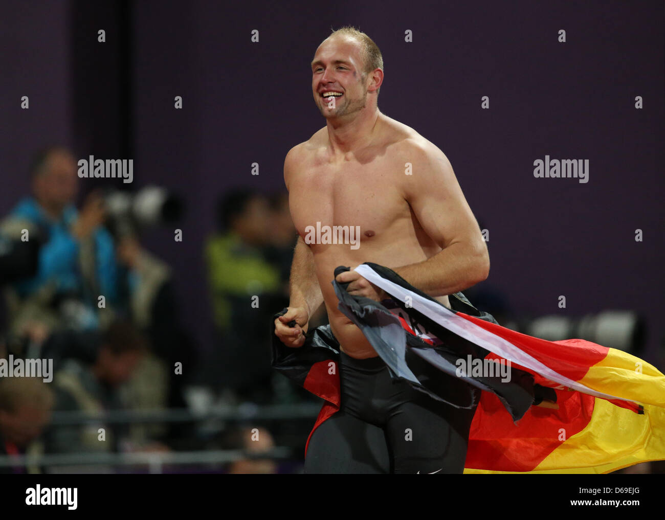 Robert Harting of Germany celebrates after winning the Men's Discus ...
