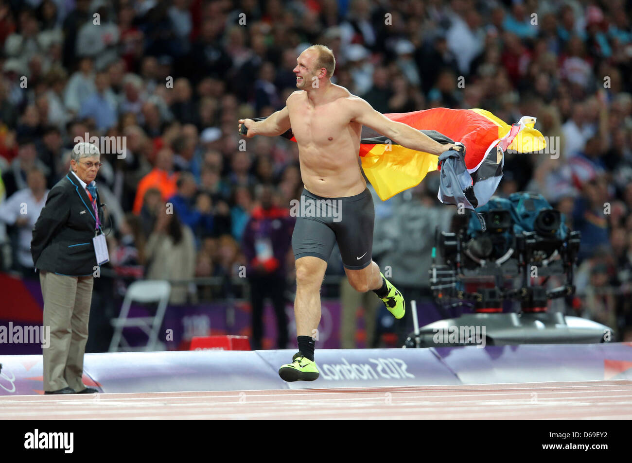 Robert Harting of Germany celebrates after winning the Men's Discus ...