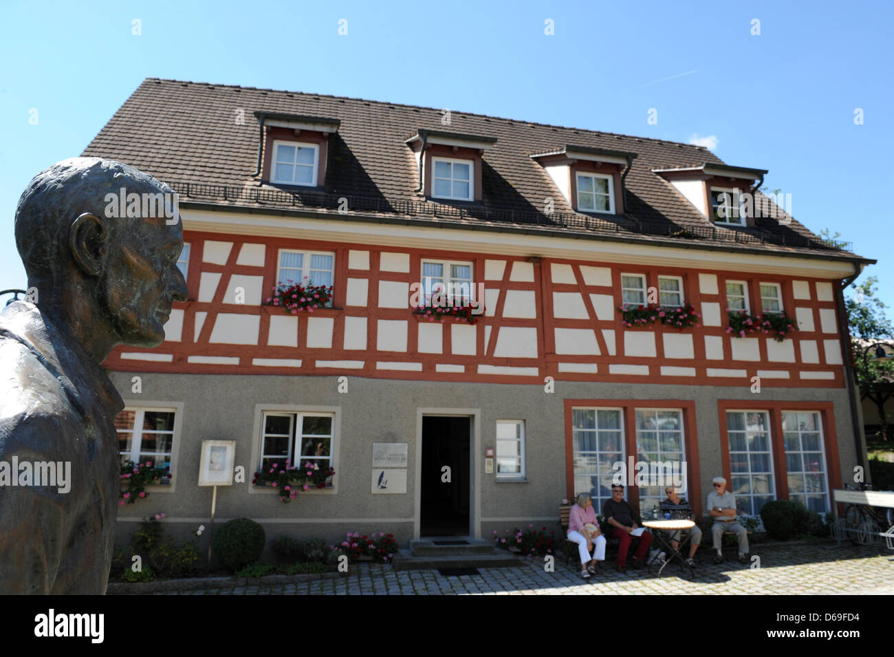 A figure of German writer Hermann Hesse stands in front og the Hermann ...
