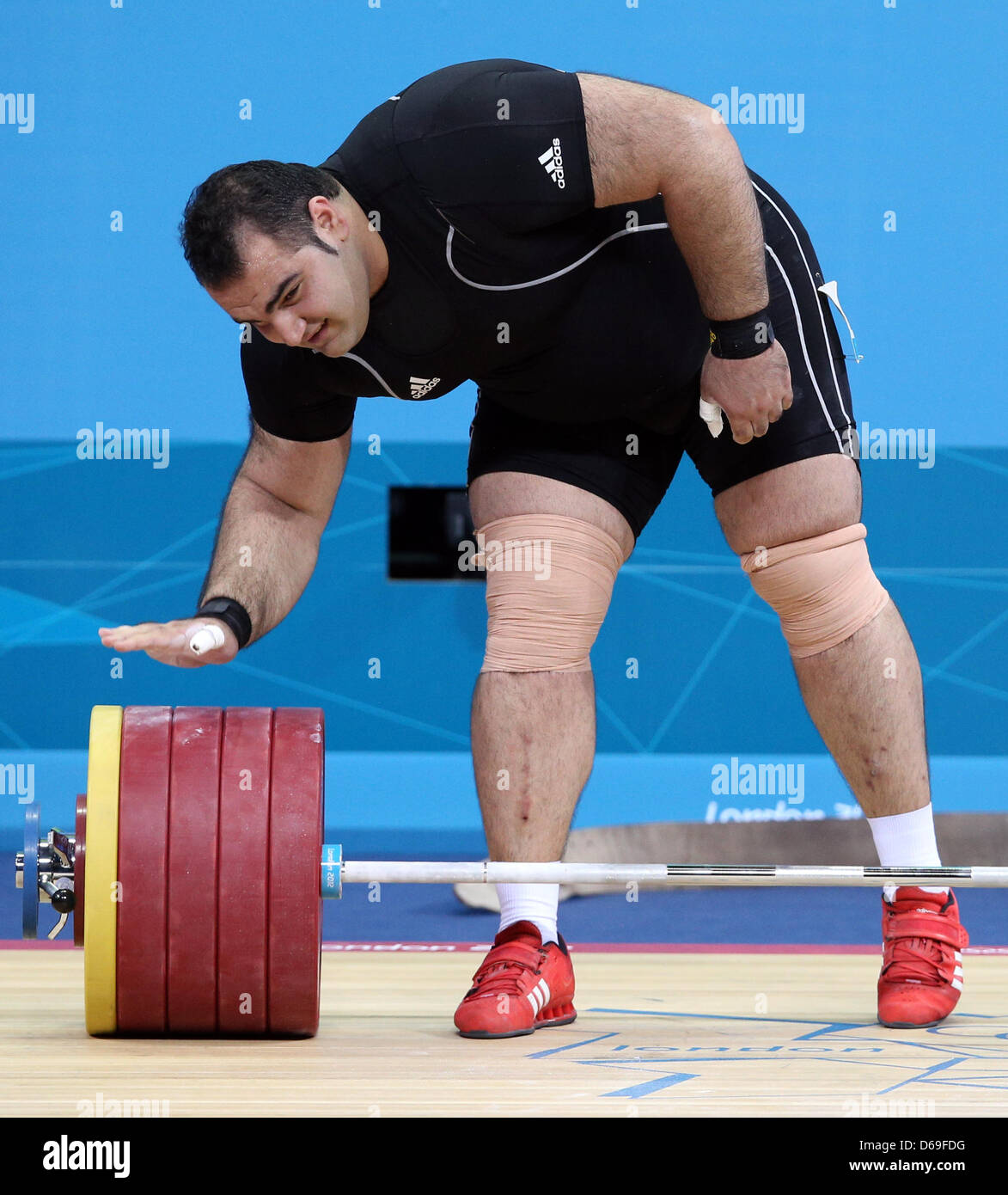 Gold medalist Behdad Salimikordasiabi of Iran celebrates in the ...